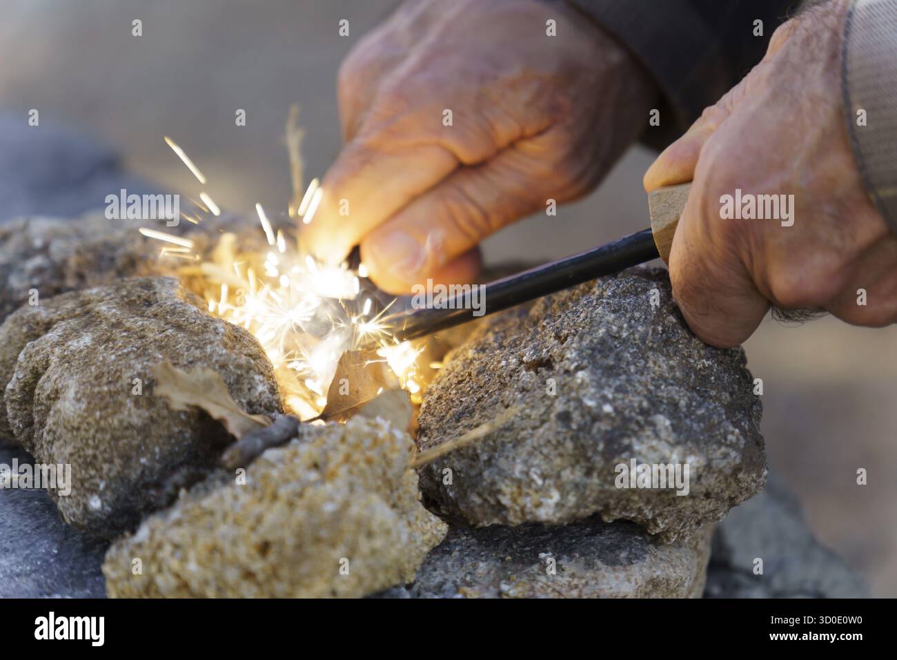 Bushcraft survivalist creating fire hi-res stock photography and images ...