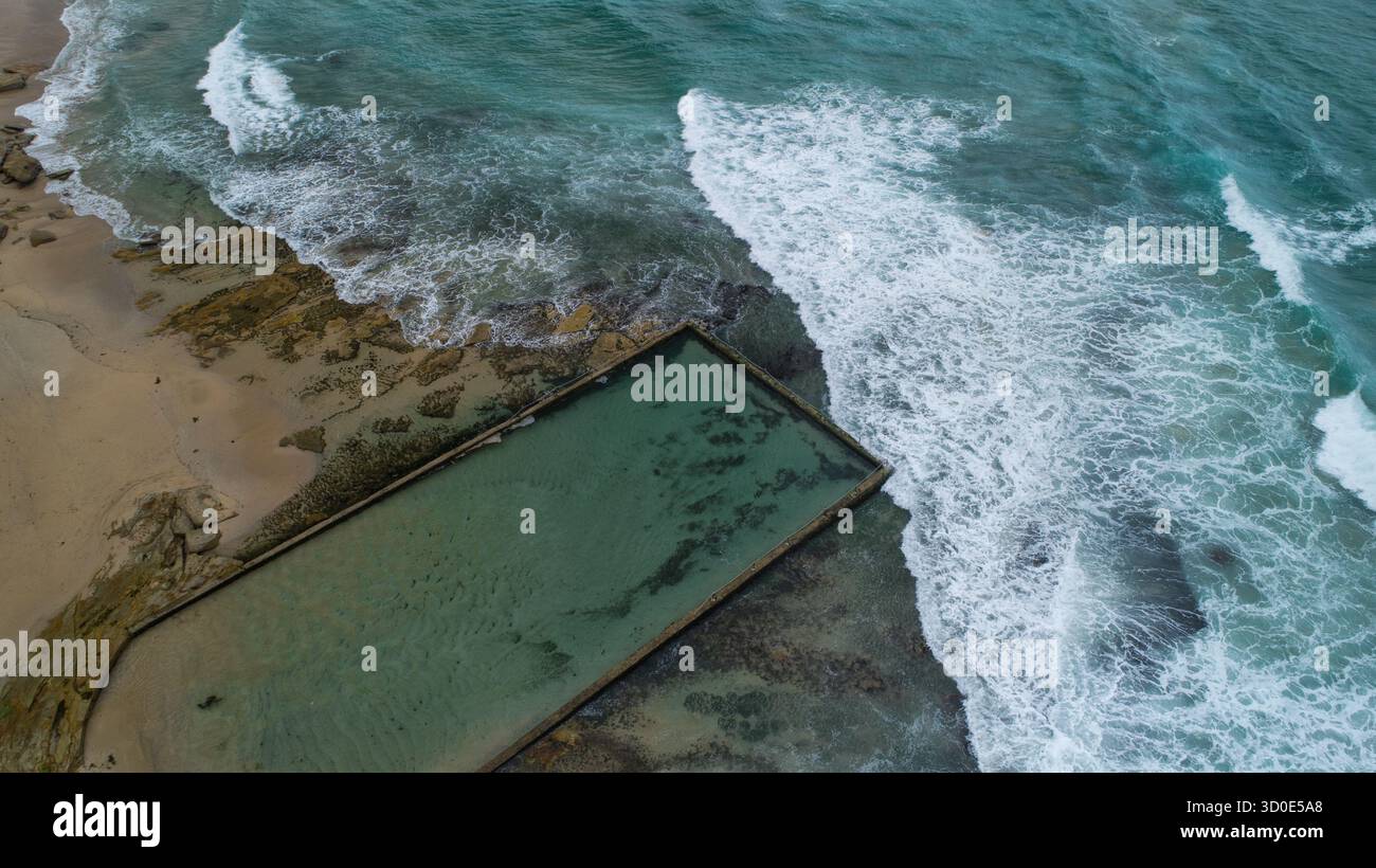 Aerial view of the crisp, turquoise waters of the ocean pool contrast ...