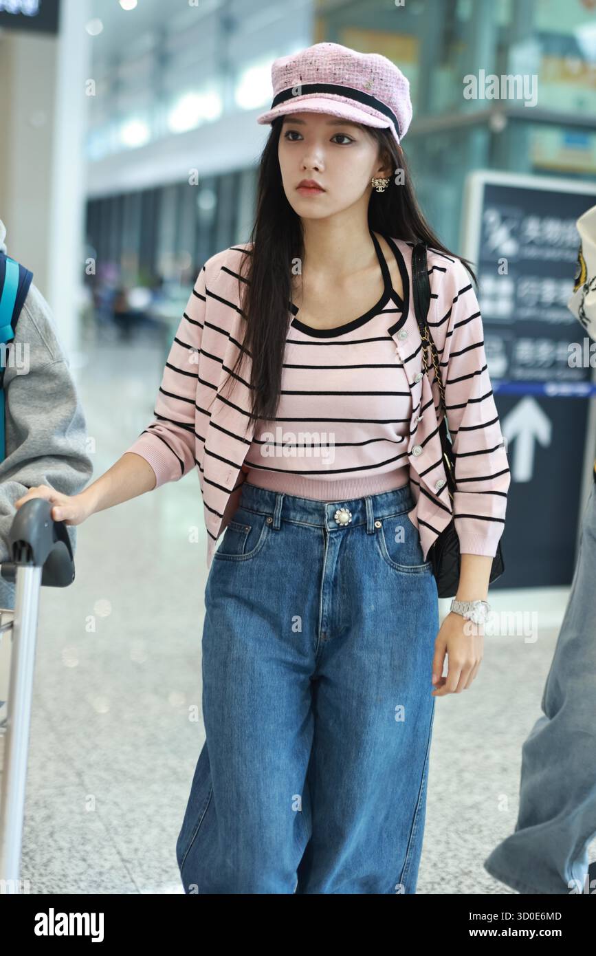 Chinese singer, dancer and actress Cheng Xiao appears at the airport in ...