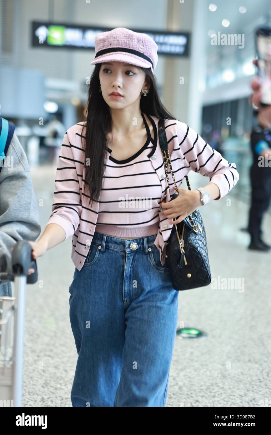 Chinese singer, dancer and actress Cheng Xiao appears at the airport in ...