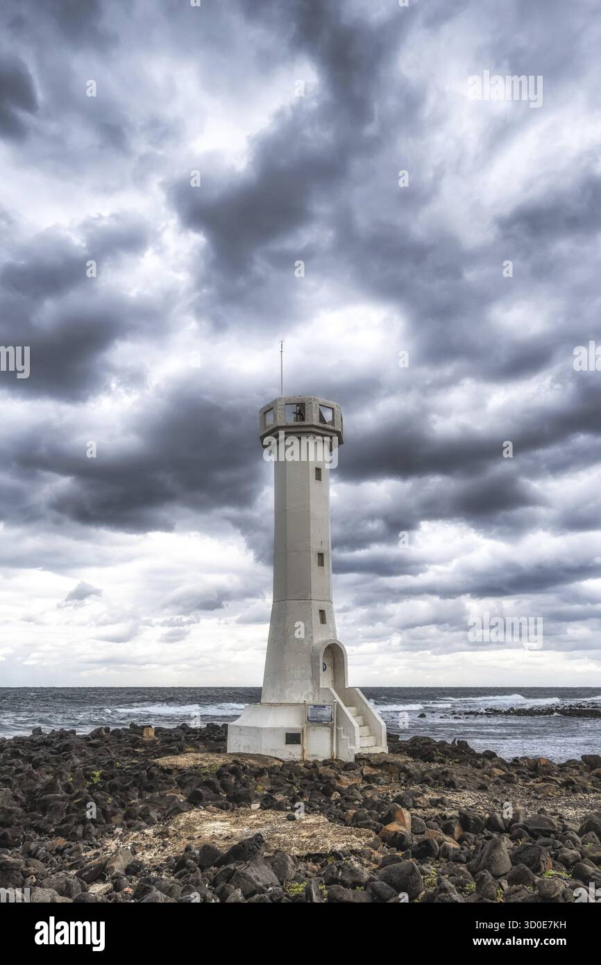 Udo Mangru Lighthouse with storm clouds above. Taken in Jeju Island ...