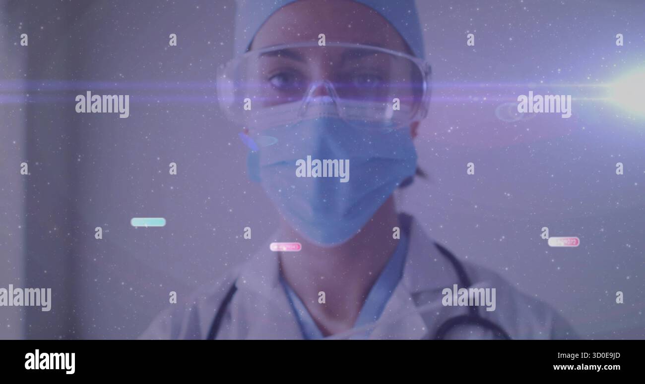 Standing doctor wearing mask cap goggles and coat in clinic, with ...