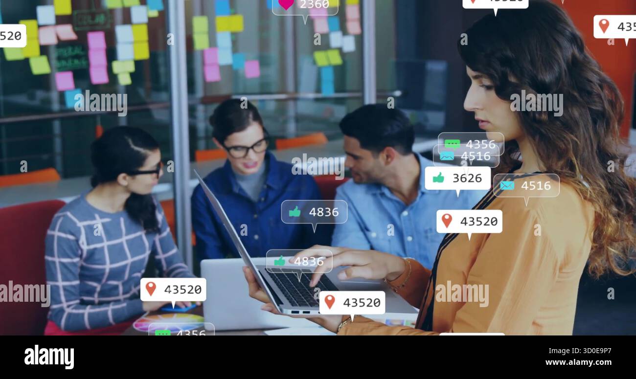 Pointing woman with laptop, team viewing laptop near sticky note ...