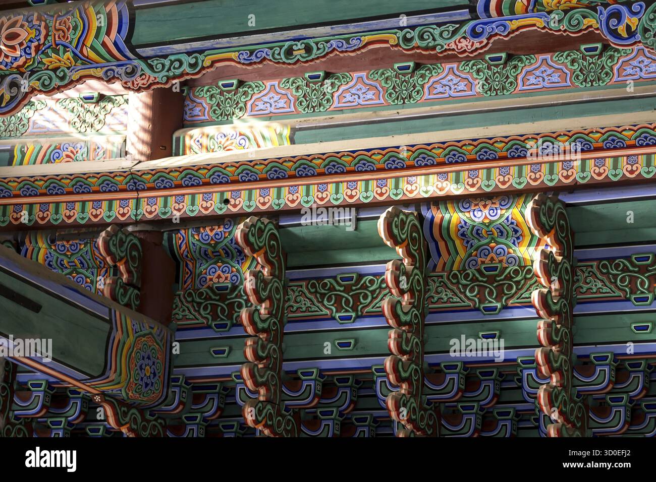 Sunlight shining on korean traditional patterned ceiling in gyeongbok ...