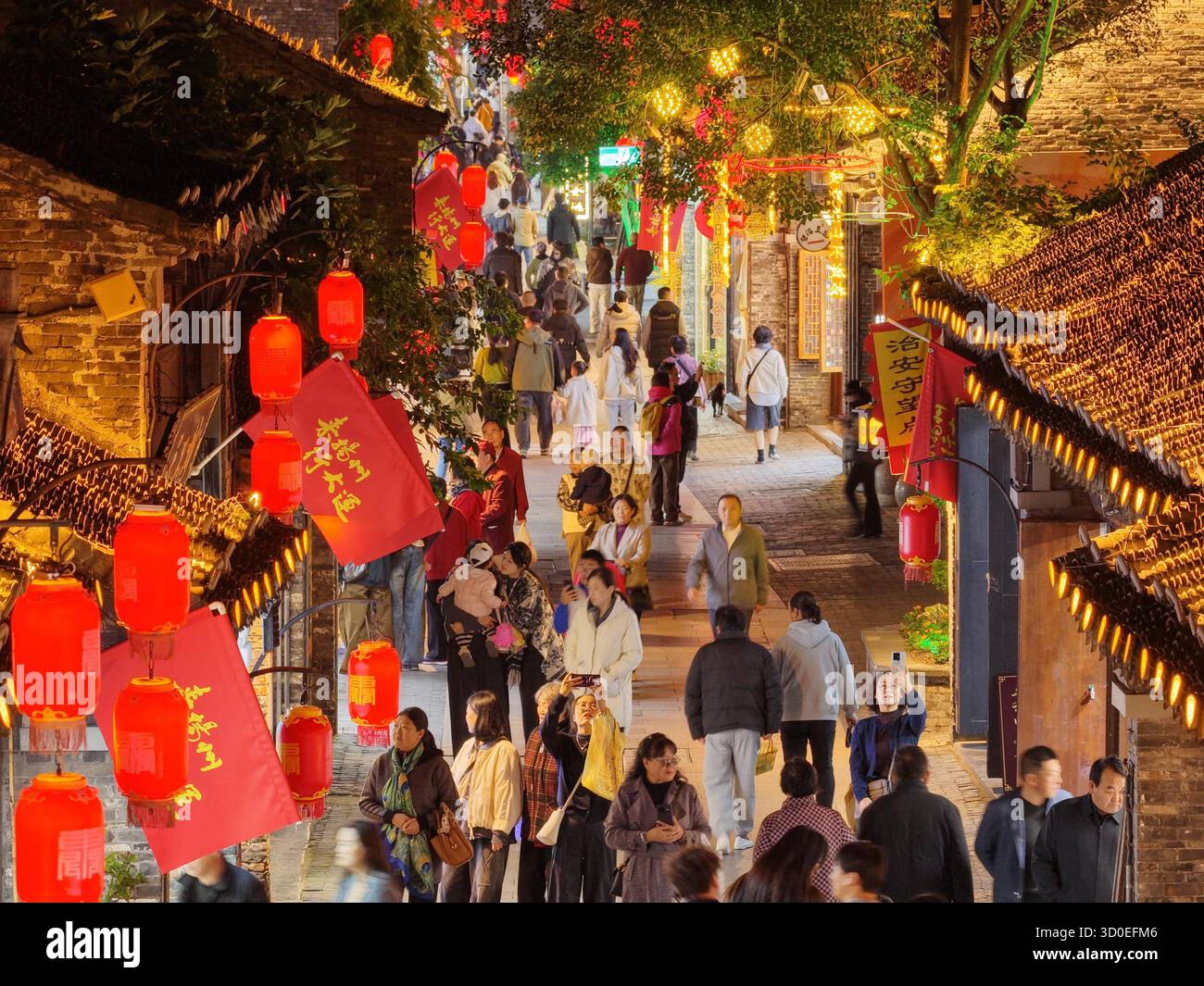 Tourists stroll in Dongguan Street at night in Yangzhou City, east ...
