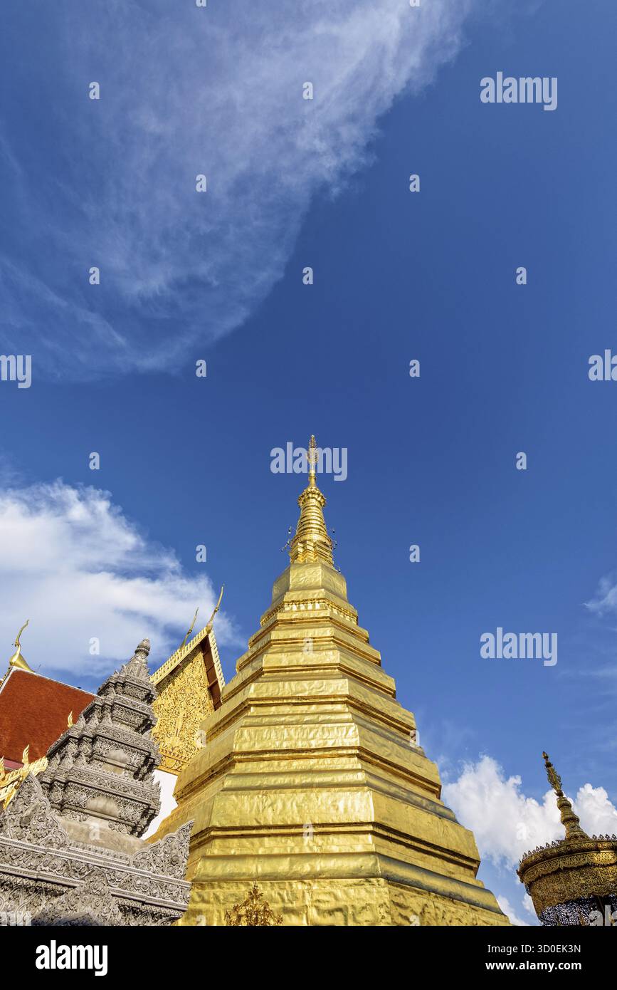 Wat Phra That Cho Hae Buddhism Temple with golden pagoda on blue sky ...