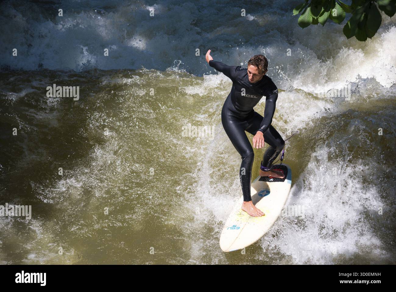 Munich, Germany - June 7, 2016: Boarders surfing on the Isar river in ...