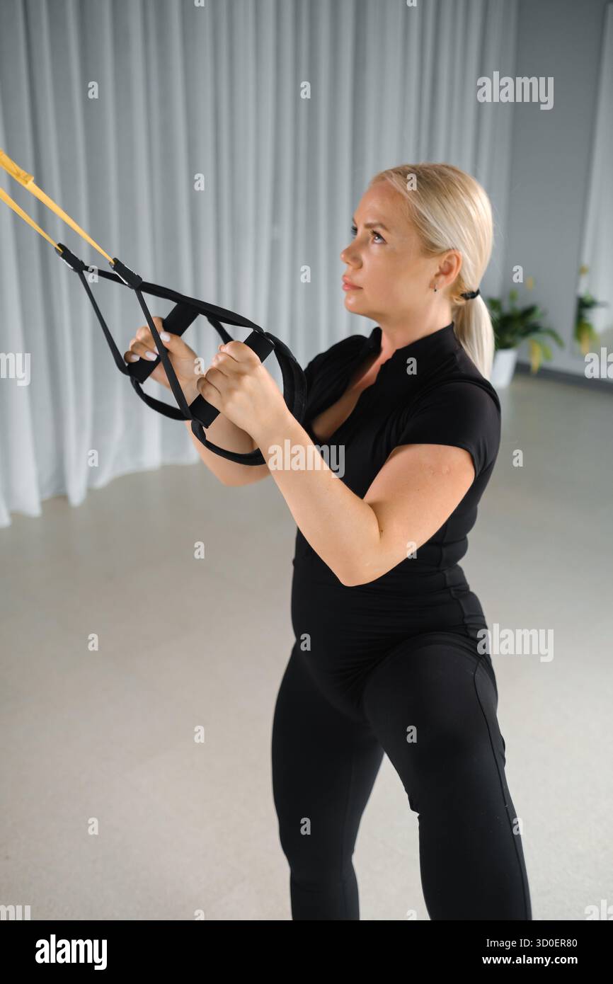Woman engaging in stretching routine hi-res stock photography and ...
