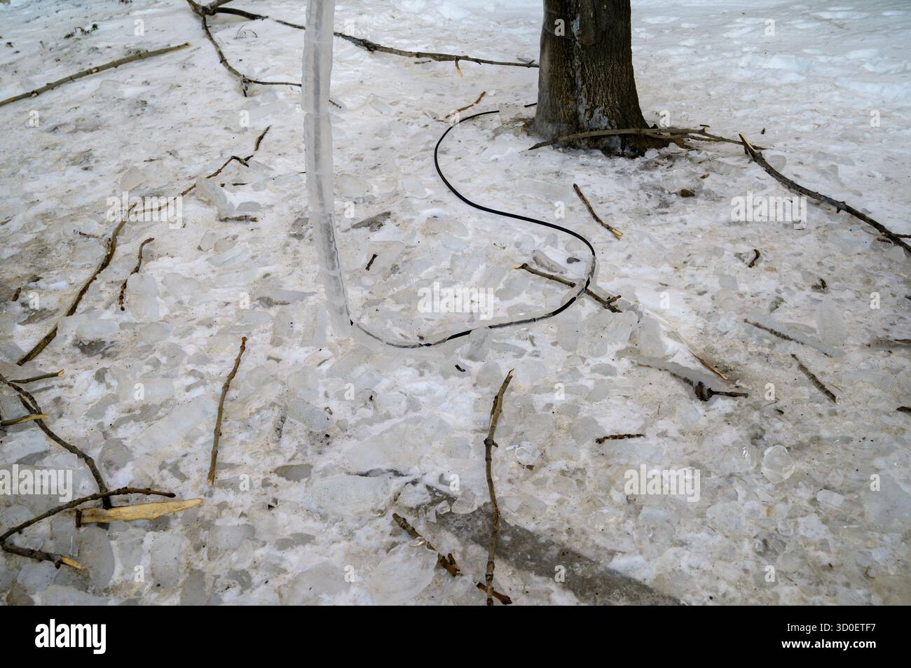 Ice-covered cables fell from a pole during severe winter weather Stock ...