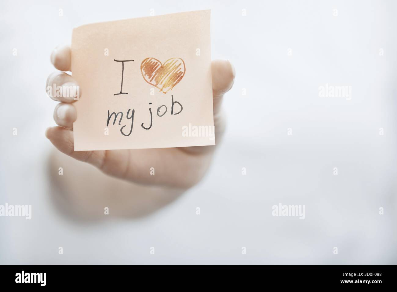 Hand holding heart adhesive hi-res stock photography and images - Alamy