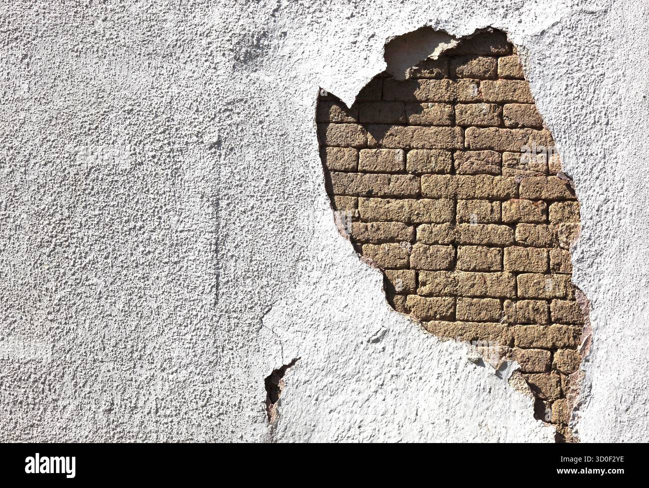 Structural damage, wall damage, flaking plaster and wall paint, bricks ...