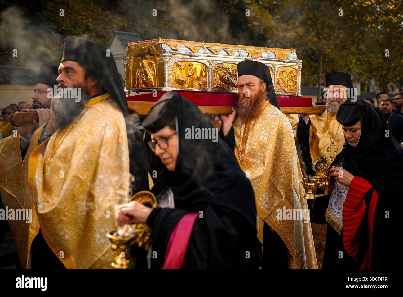 Orthodox priests carry holy remains during the procession of Saint ...