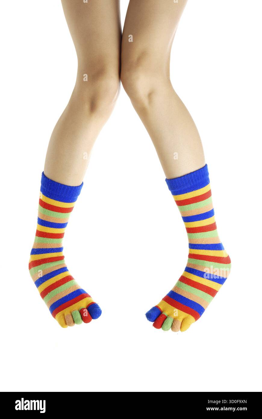 Close-up two thin human legs in stripped hoses Stock Photo - Alamy