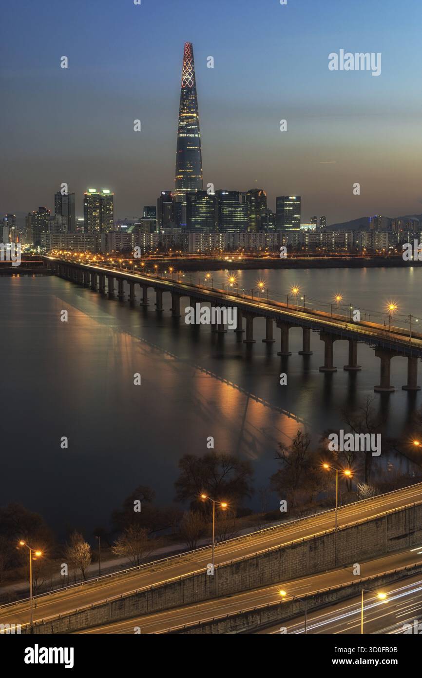 The iconic lotte tower taken at night with the view of jamsil railway ...