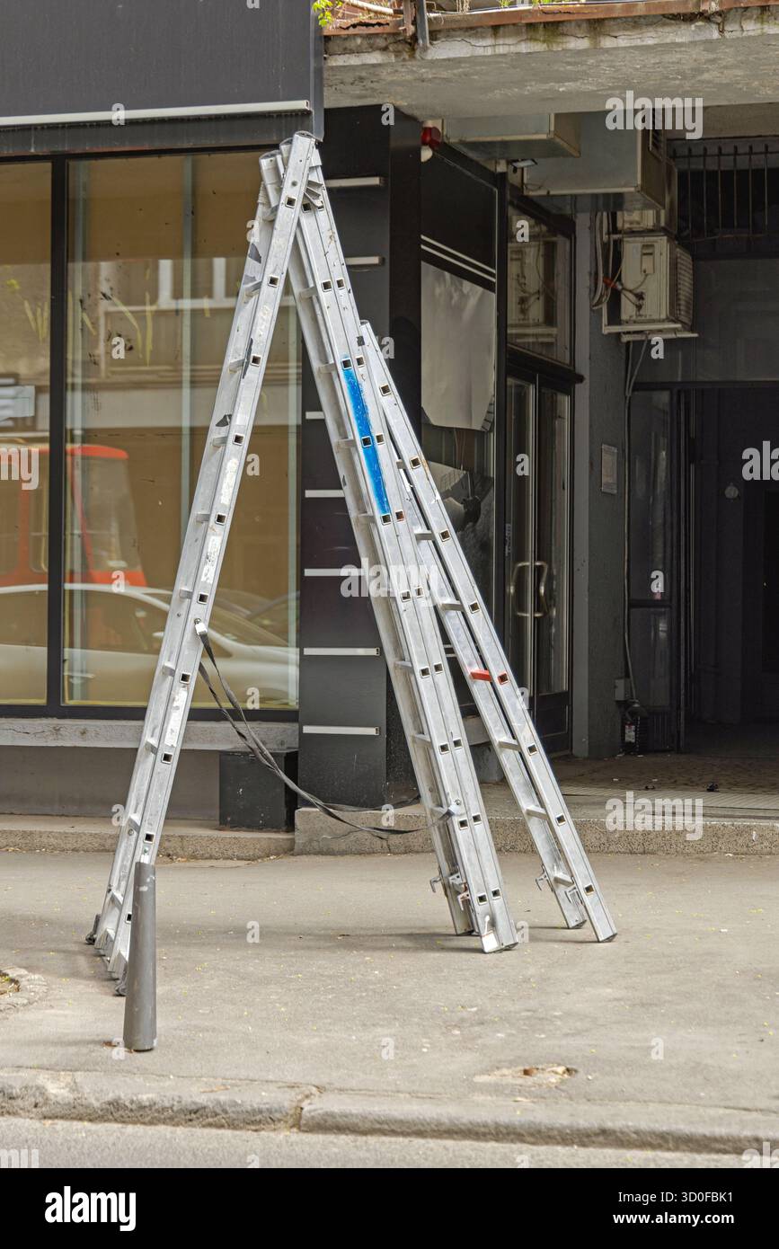 Tall Aluminium Free Standing Ladder in Front of Store at Street Stock ...