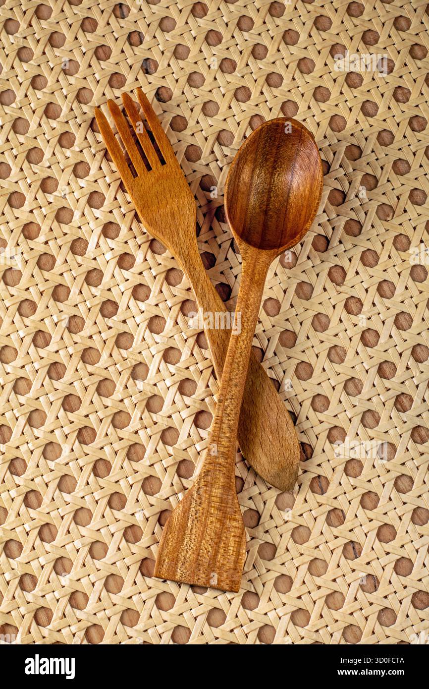 This image showcases a vintage wooden fork and spoon elegantly placed ...