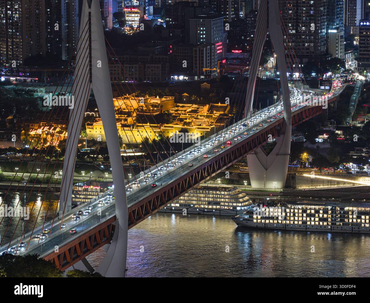 Aerial view of the illuminated Qiansimen Bridge stretches across the ...