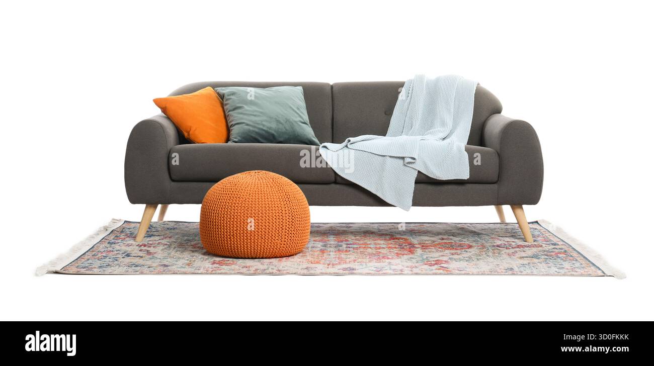 Soft sofa, pouf and carpet isolated on white Stock Photo - Alamy