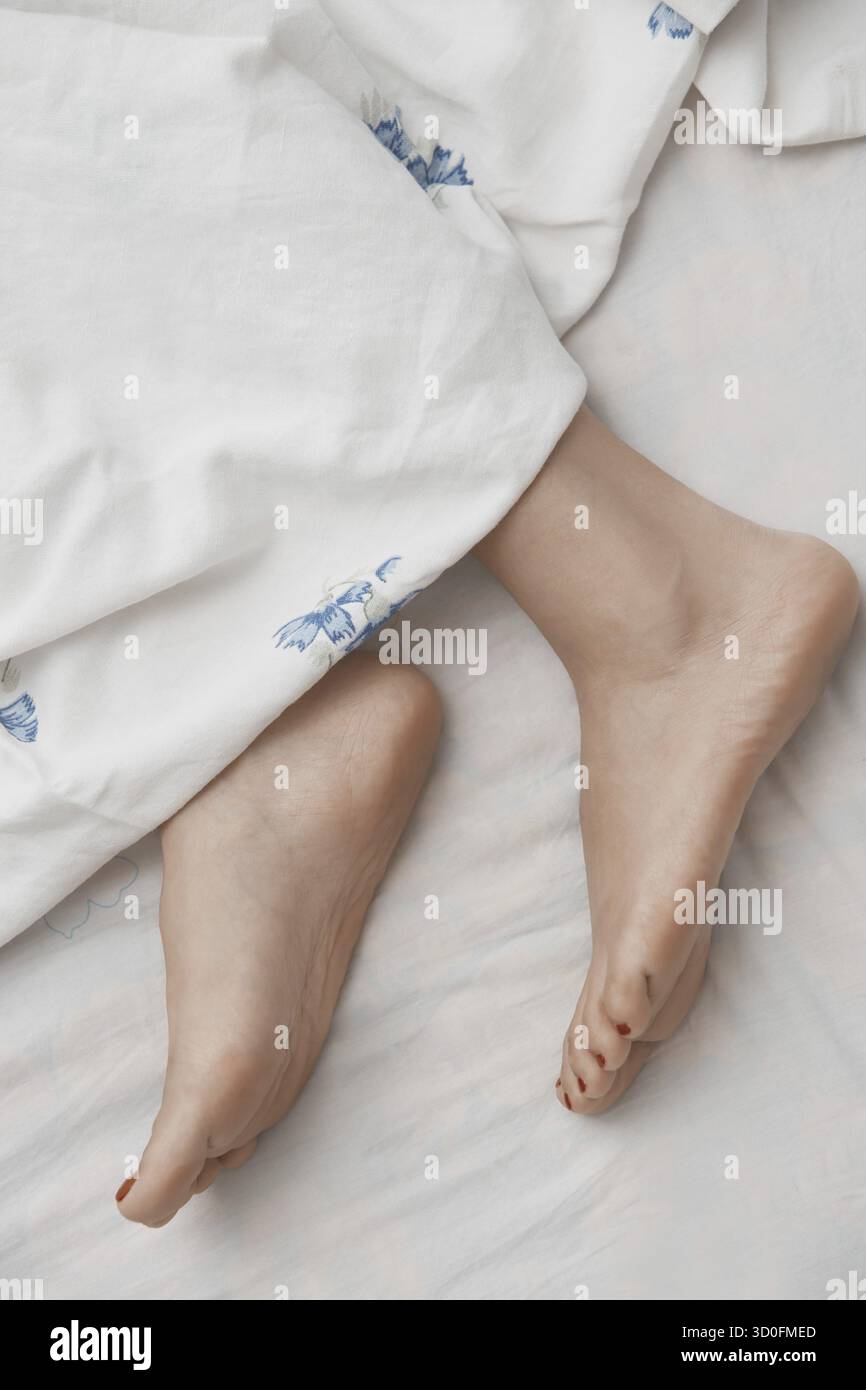 Feet sleeping woman vertical hi-res stock photography and images - Alamy