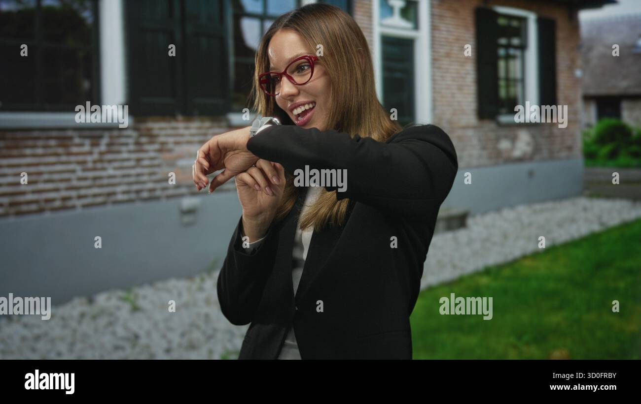 Woman checks smartwatch building hi-res stock photography and images ...