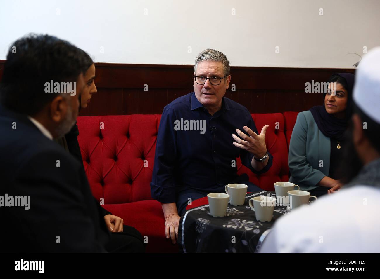 Britain's Prime Minister Keir Starmer, centre, and Home Secretary ...