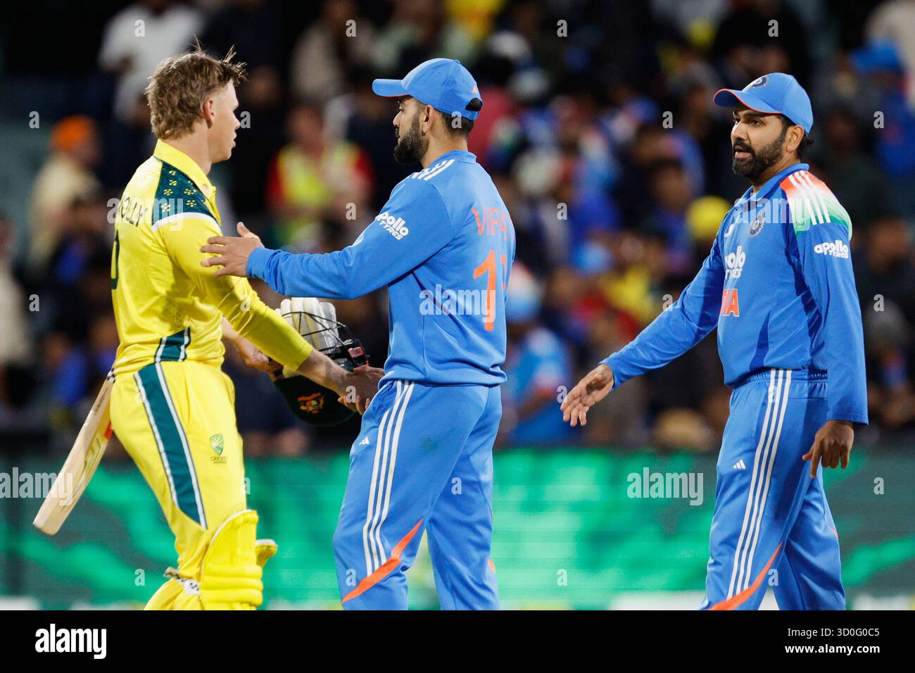 Australia's Cooper Connolly, left, shakes hands with India's Virat ...
