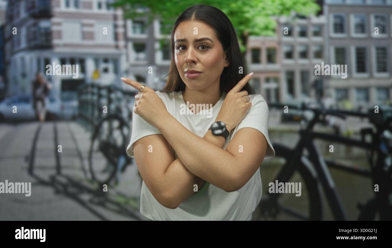 Woman crossed arms index fingers hi-res stock photography and images ...