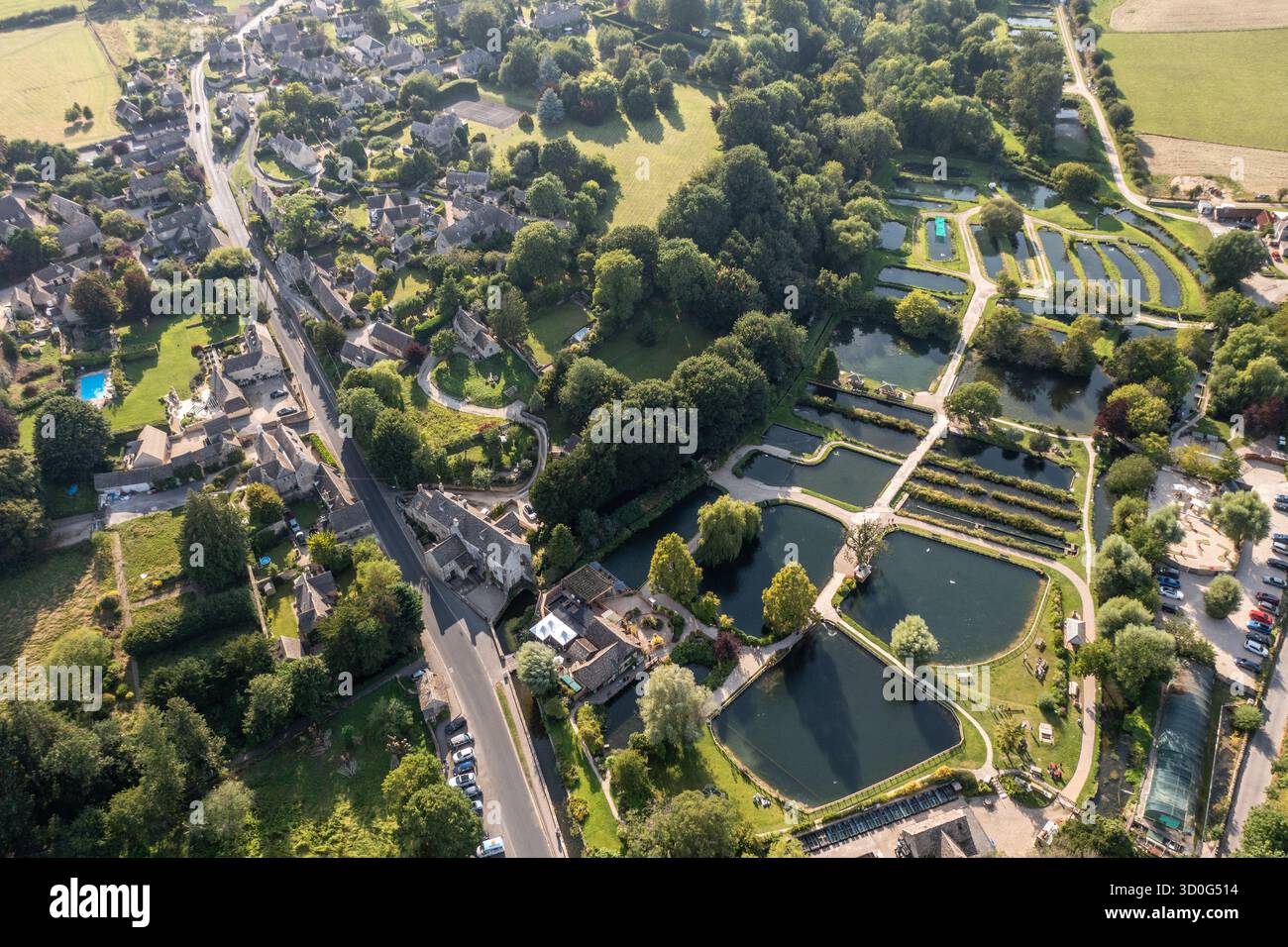 Aerial view of the Bibury Trout Farm's geometric ponds nestle beside a ...