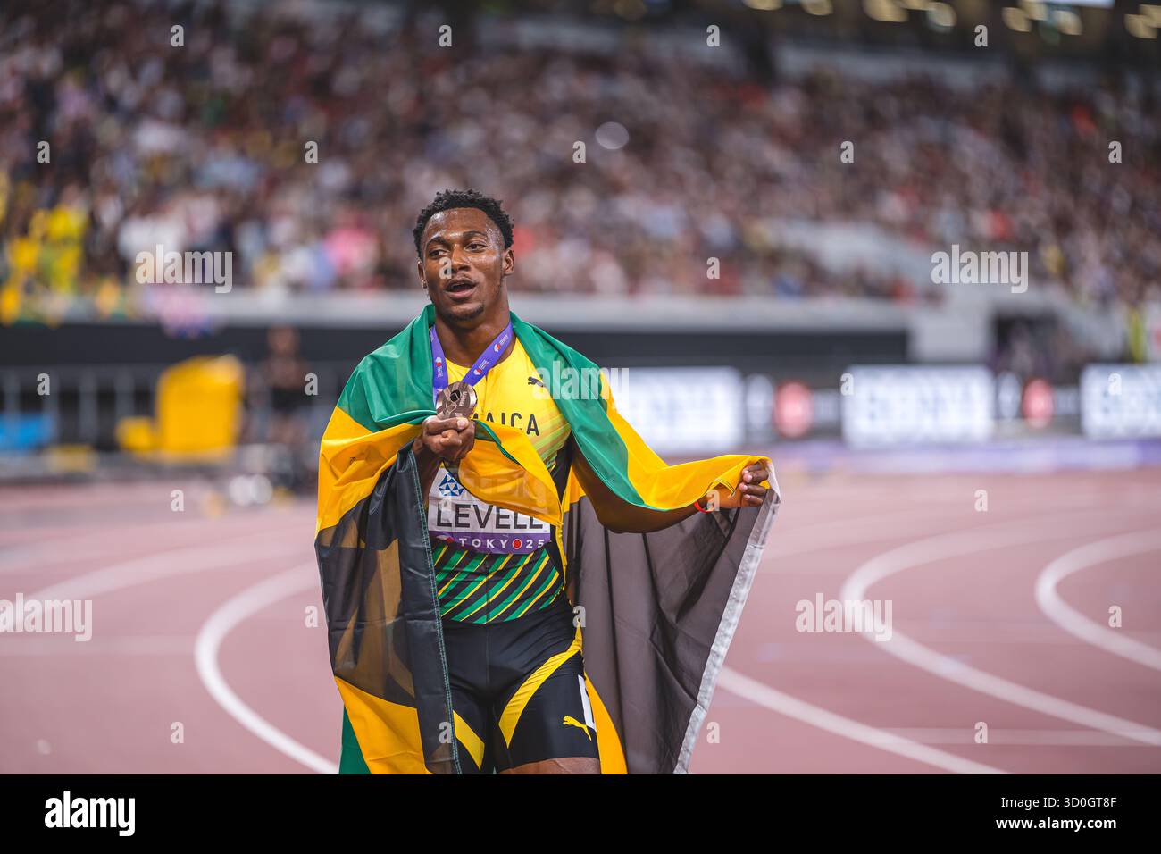 Bryan Levell celebrating her medal with her country's flag at the 2025 ...
