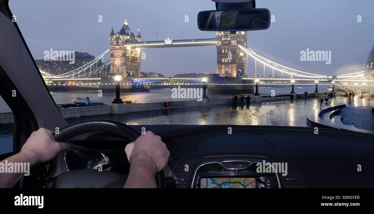 Driving a car towards Tower Bridge at night, iconic landmark in London ...