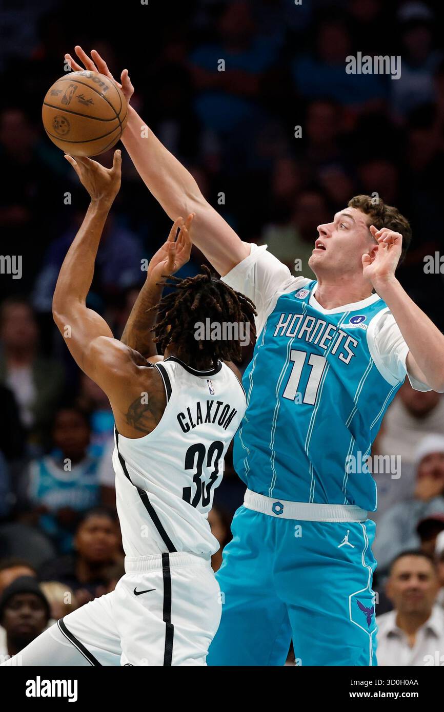 Charlotte Hornets center Ryan Kalkbrenner (11) blocks the shot of ...