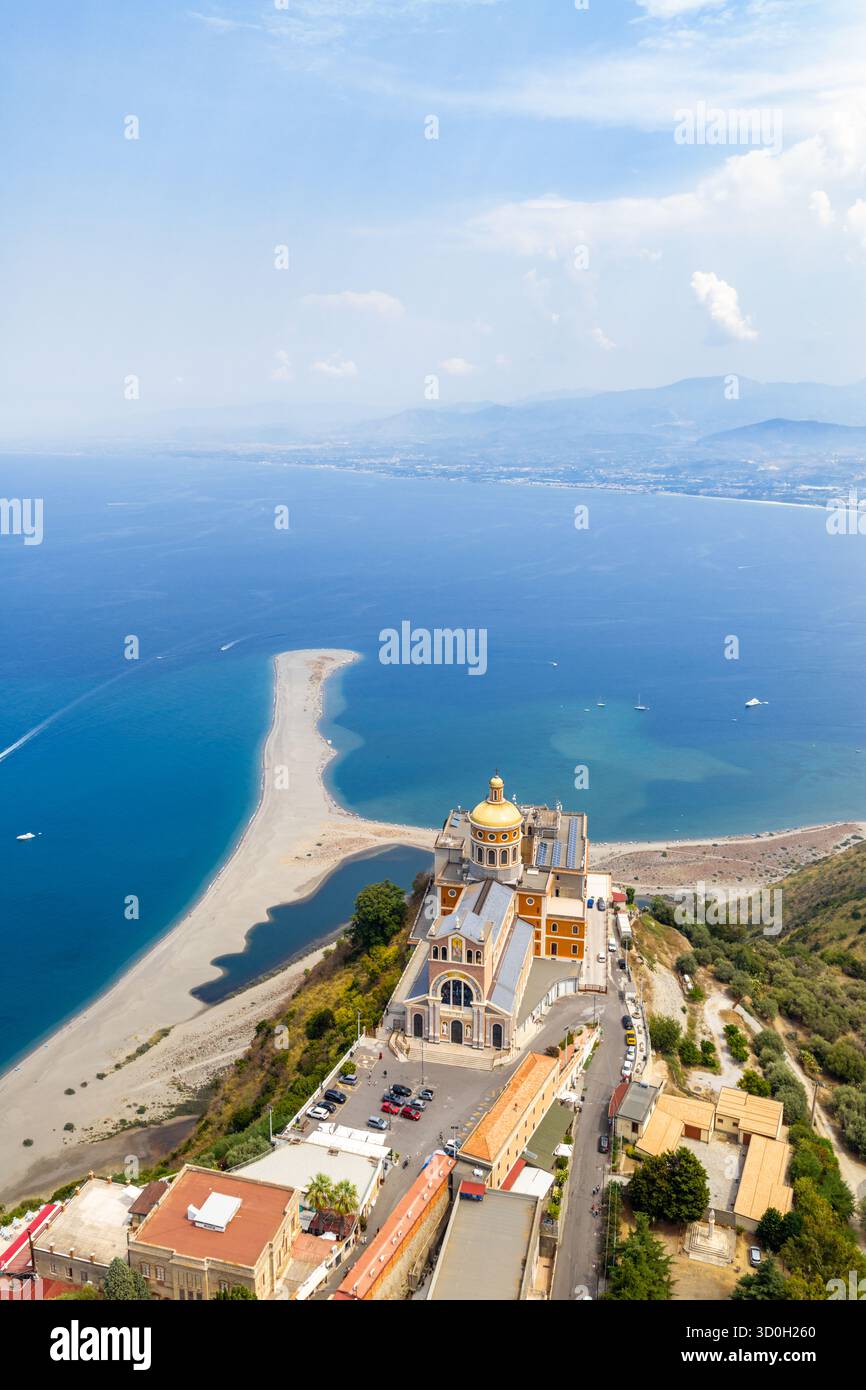 Aerial view of the golden-domed Basilica Santuario Maria del Tindari ...