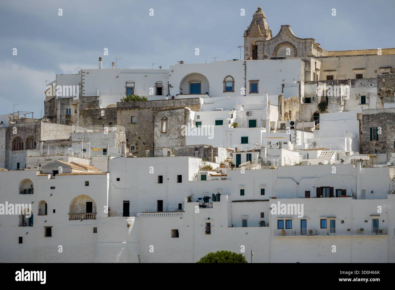 Aerial view of a cascade of dazzling white buildings, crowned by the ...