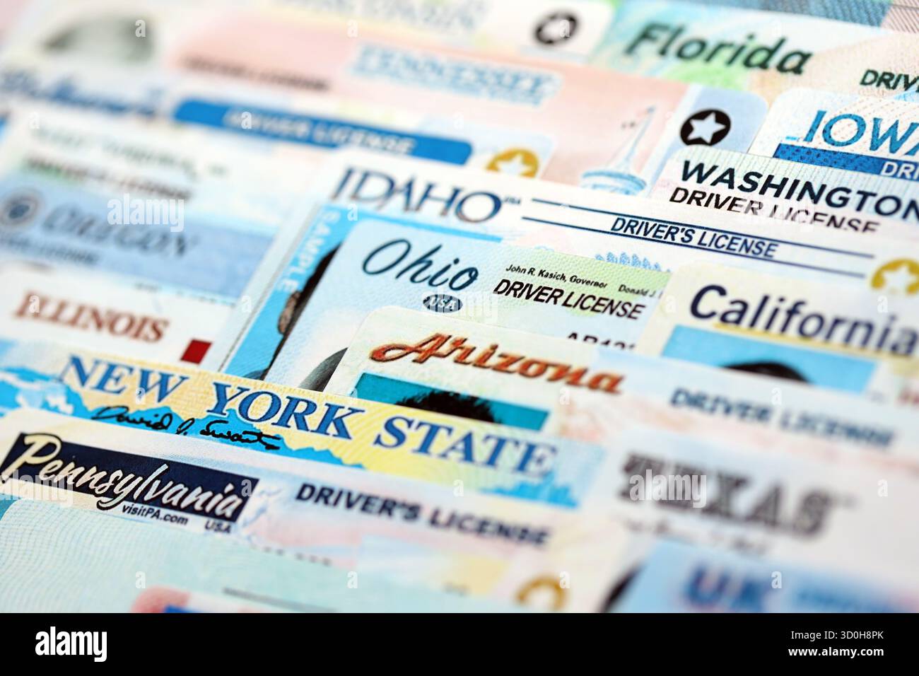 Big amount of driving licenses from various USA states. Stack of ...
