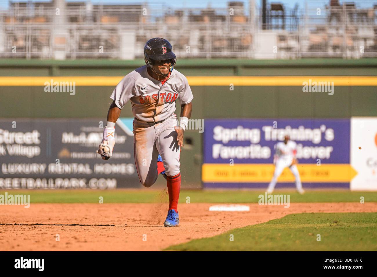 Salt River Rafters second baseman Stanley Tucker (18) steals third base ...