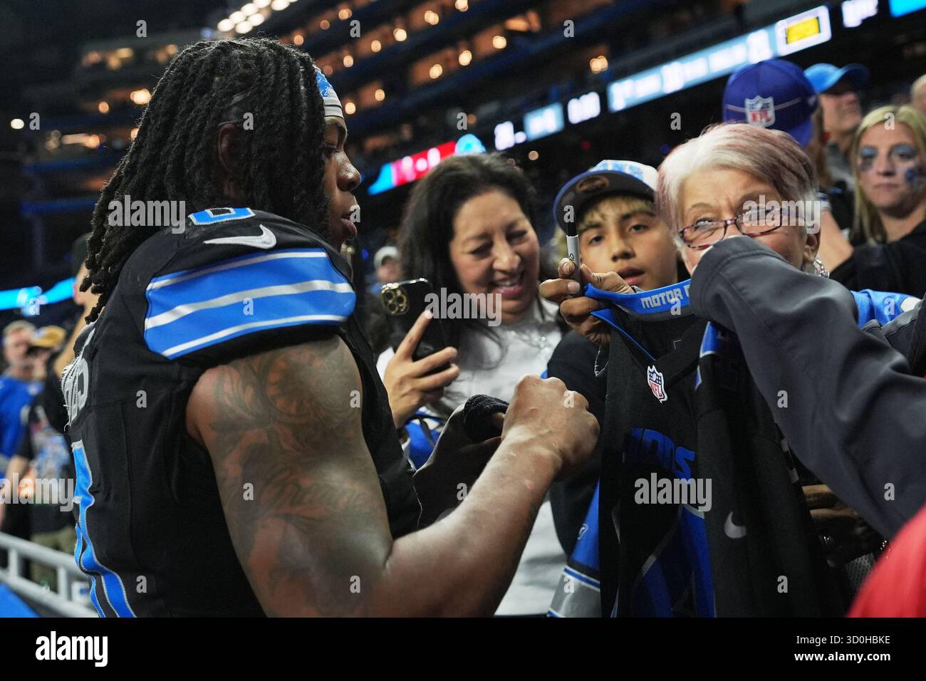 Detroit Lions running back Jahmyr Gibbs signs autographs after an NFL ...