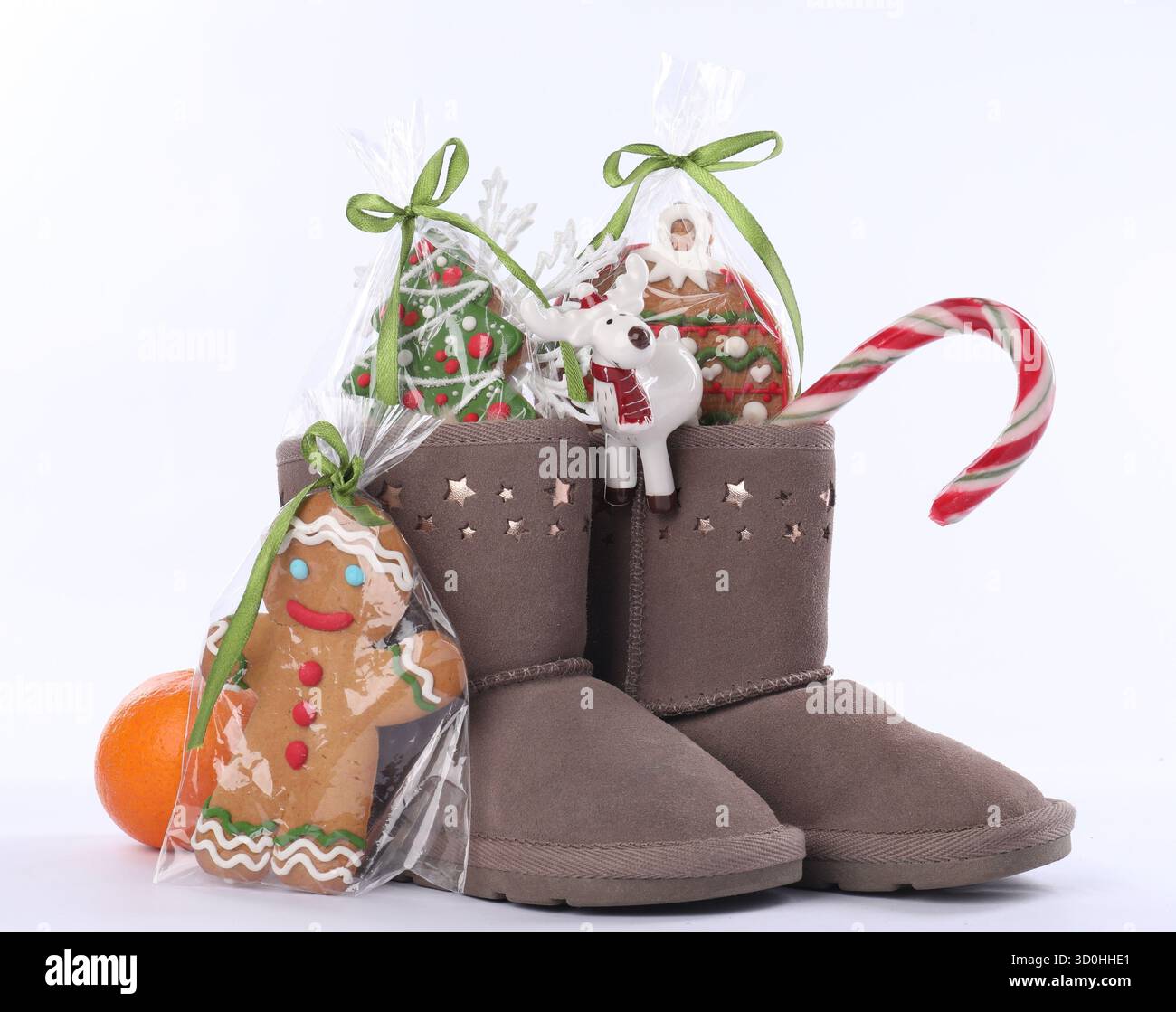 Saint Nicholas day. Boots with treats on white background Stock Photo ...
