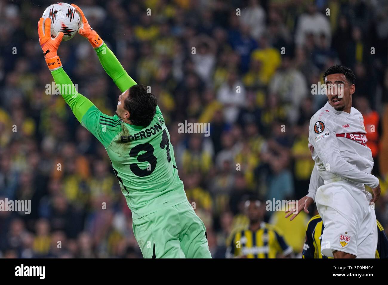 Fenerbahce's goalkeeper Ederson, left, catches the ball next to ...