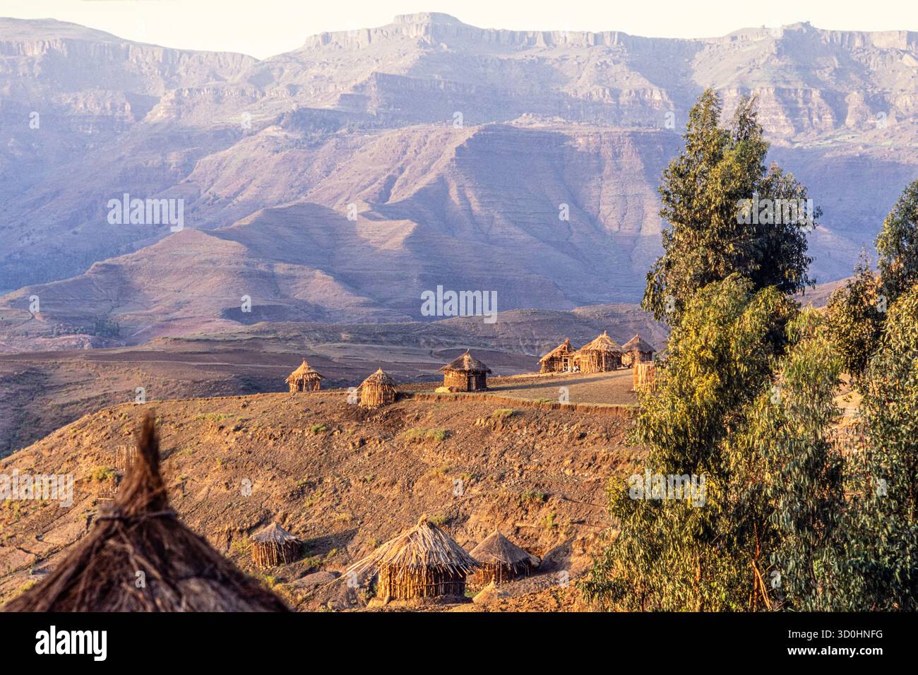 Ethiopian round huts on a mountainside in The Ethiopian Highlands near ...