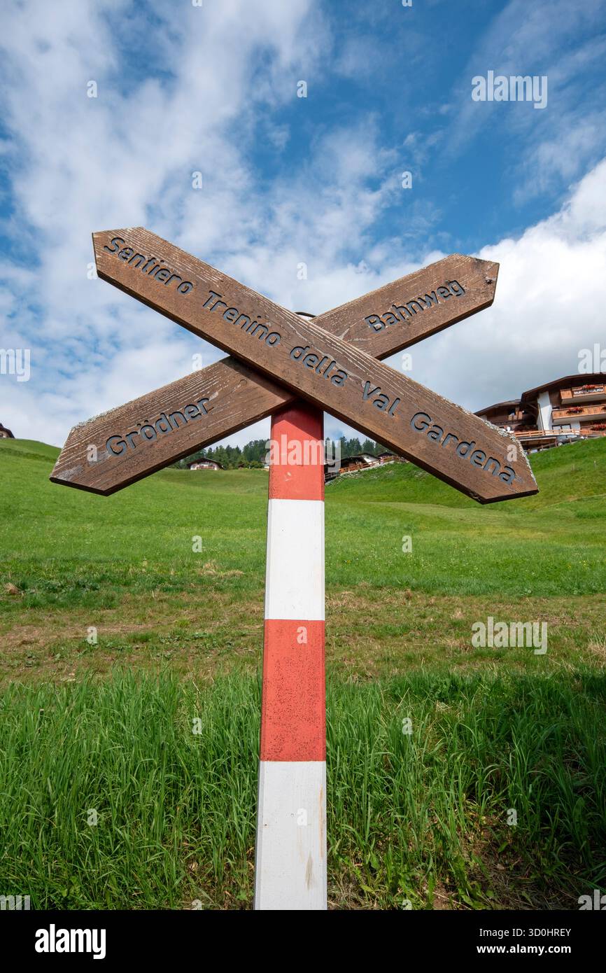 Wooden sign along the historic Val Gardena train route, Santa Cristina ...