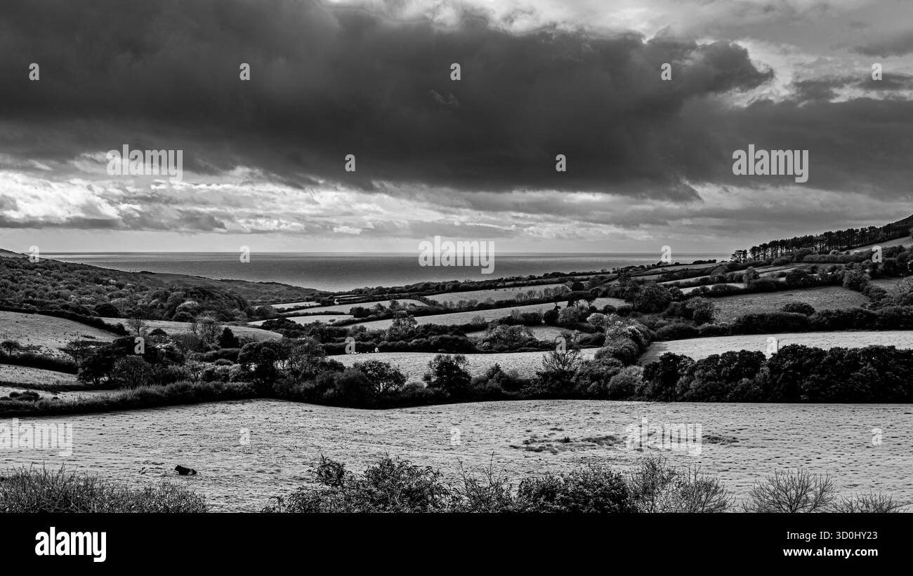 Sunshine After the Storm Over Rolling Countryside Fields and the coast ...