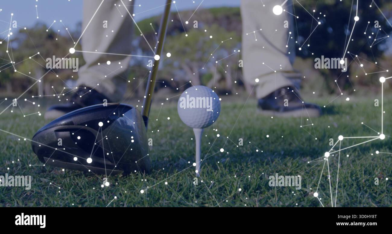 Showcasing white golf ball on tee at course fairway, with driver head ...