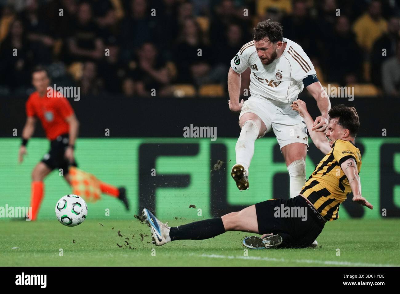 Aberdeen's Nicky Devlin tries to score as AEK Athens' James Penrice tries to stop him during the ...