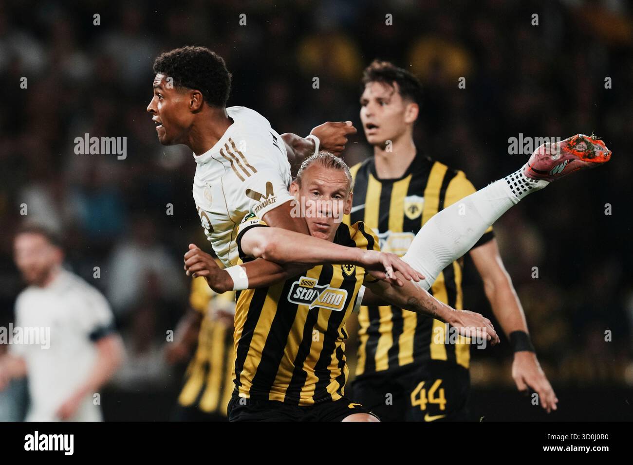 Aberdeen's Gavin Molloy left, and AEK Athens' Domagoj Vida fight for ...