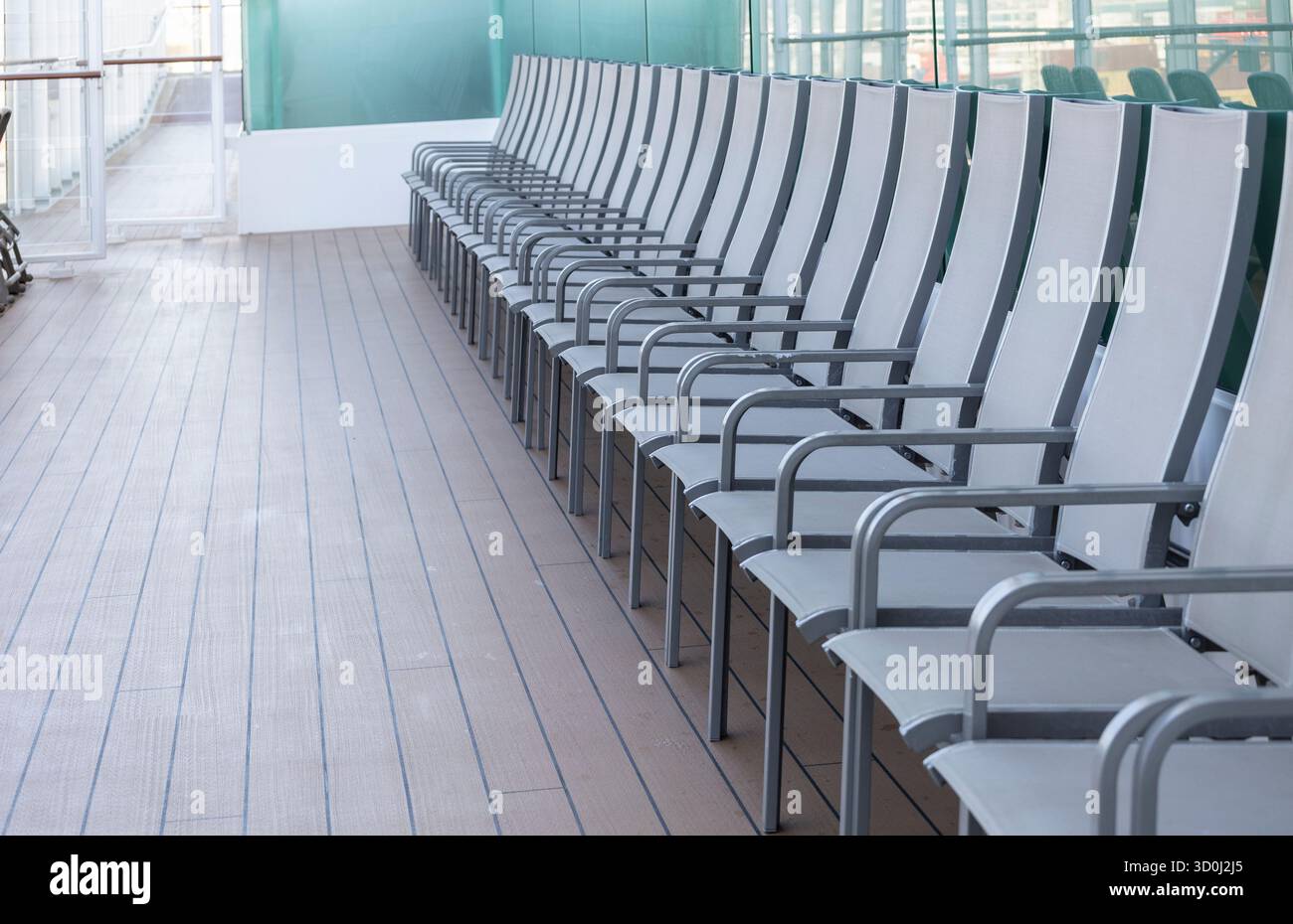 Cruise Ship Deck Seating: Row of Chairs Along Glass Railing With ...