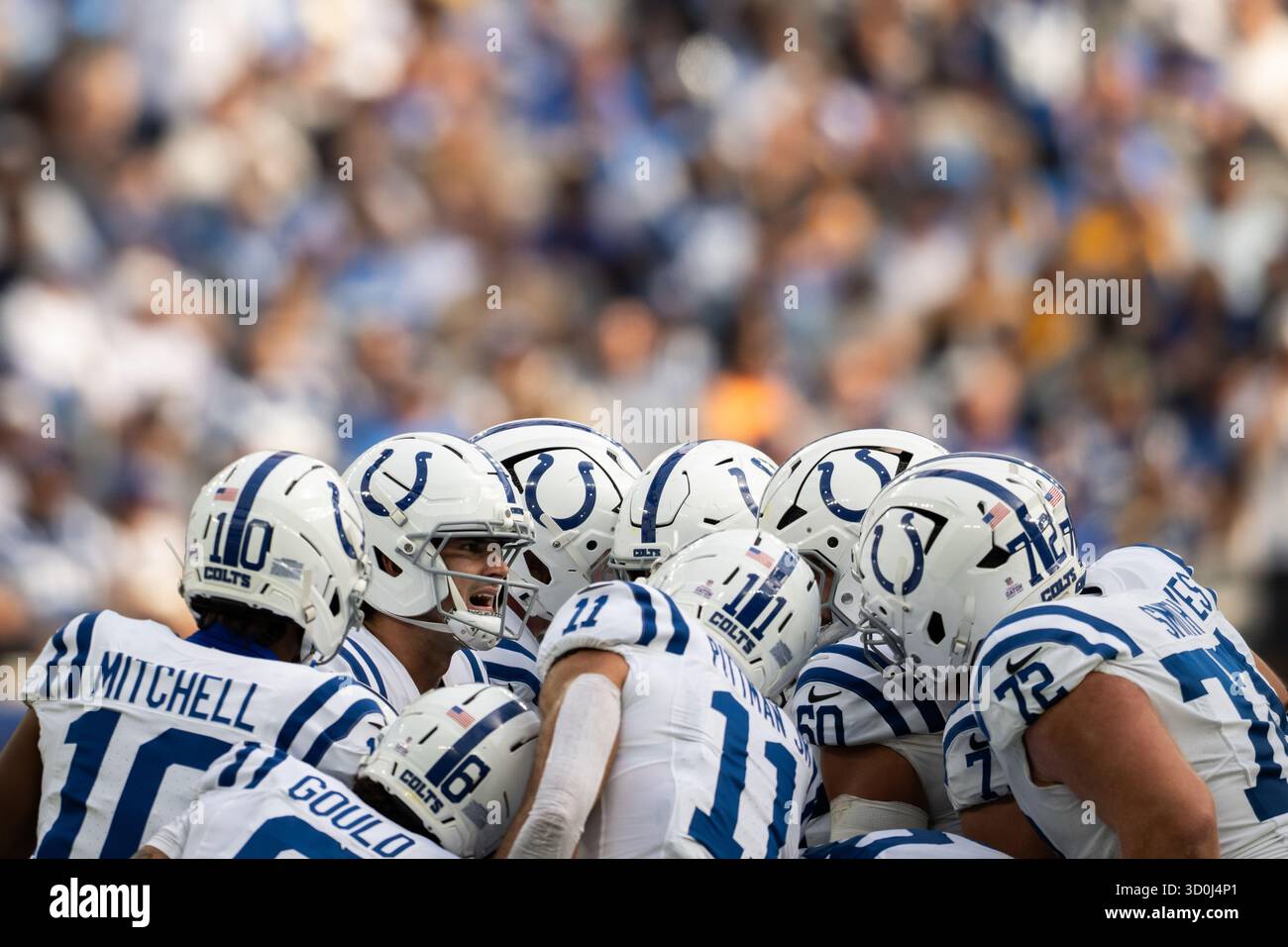Indianapolis Colts players huddle during an NFL football game against ...
