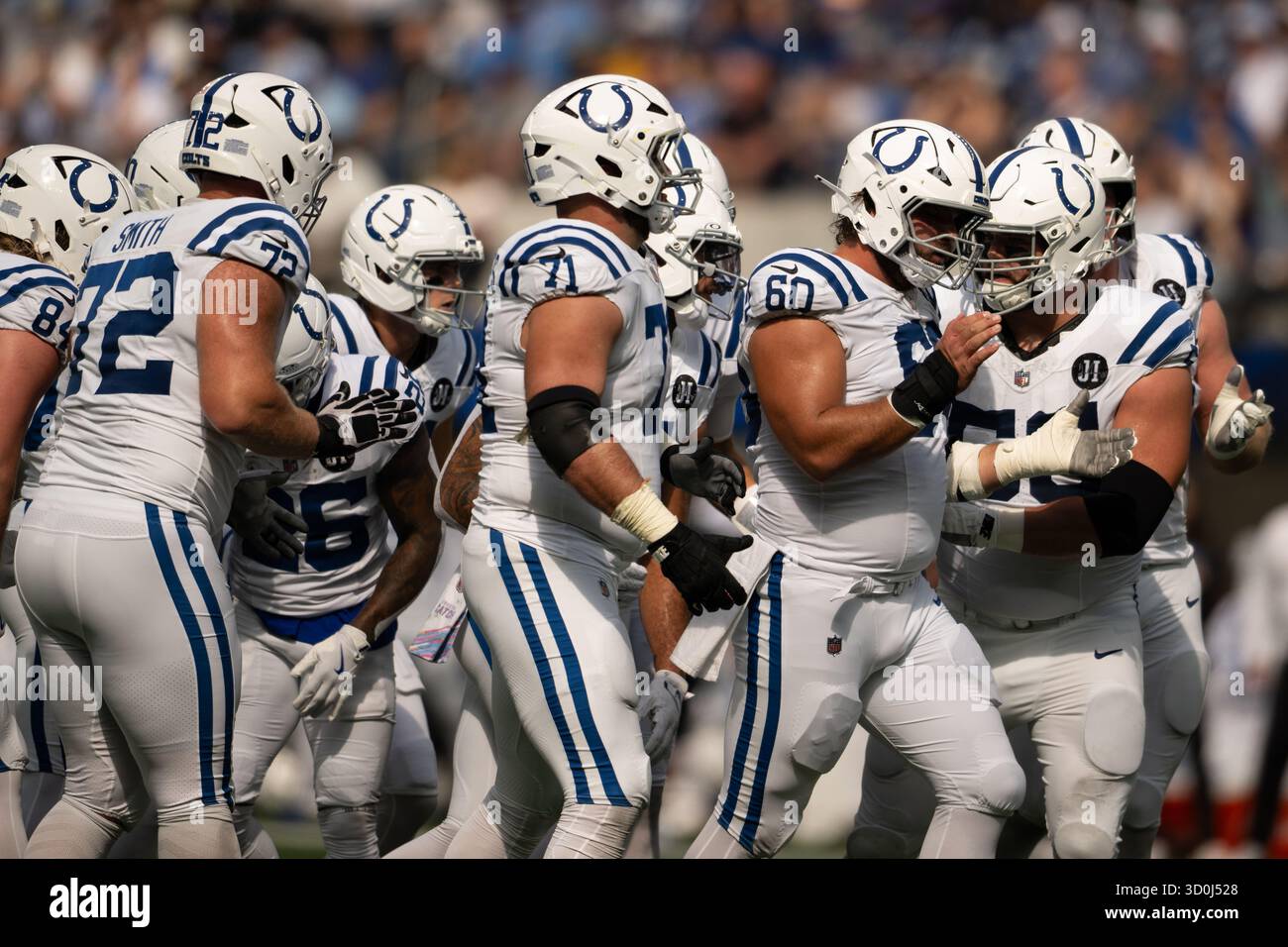 Indianapolis Colts players huddle during an NFL football game against ...