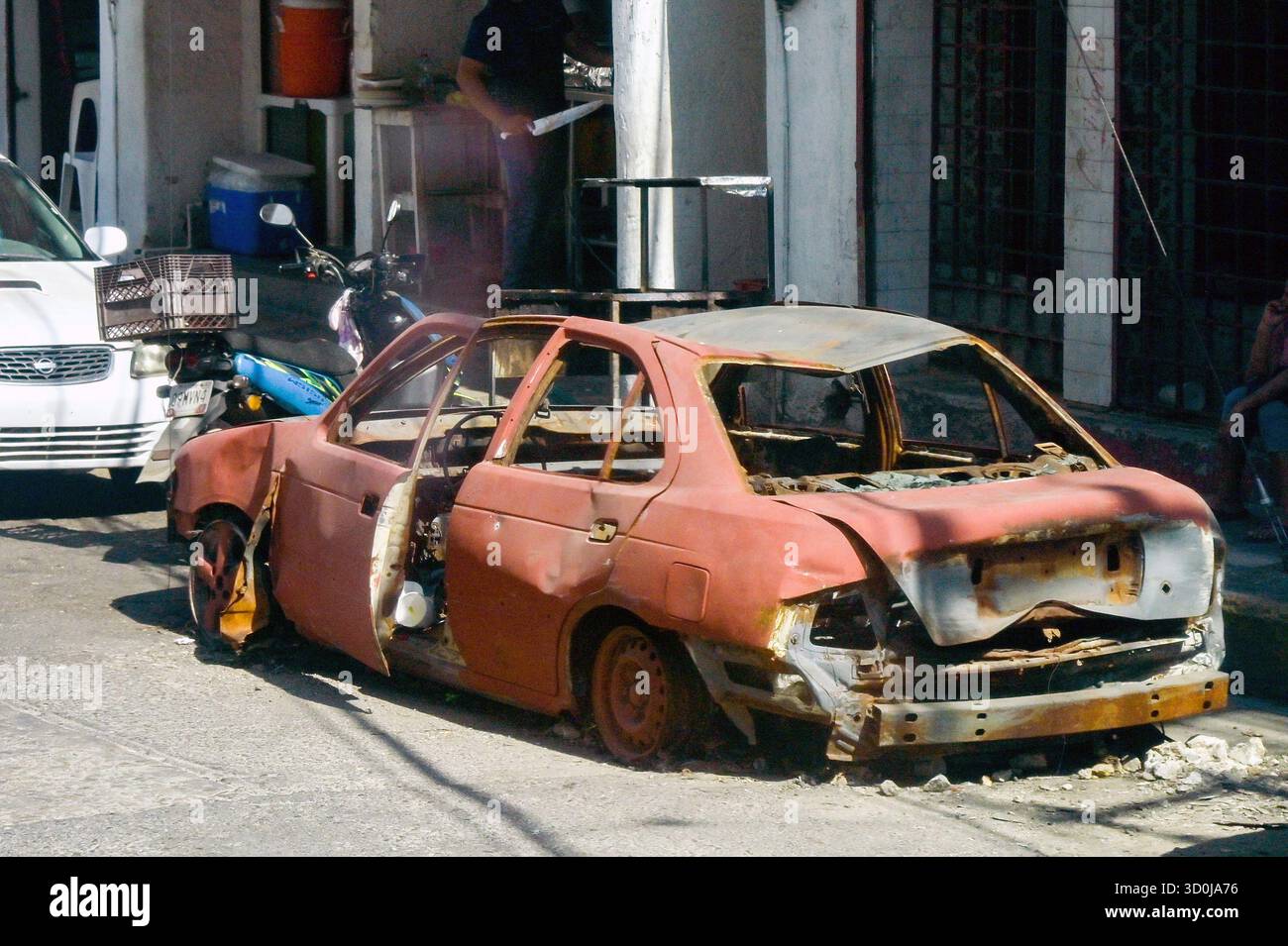 Acapulco, Mexico - 17 January 2024: Burnt out car on a street in ...