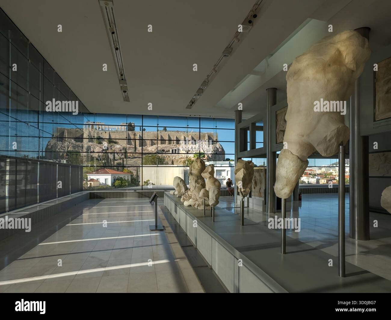 Marble statues and a view of the Acropolis and Parthenon seen from the ...