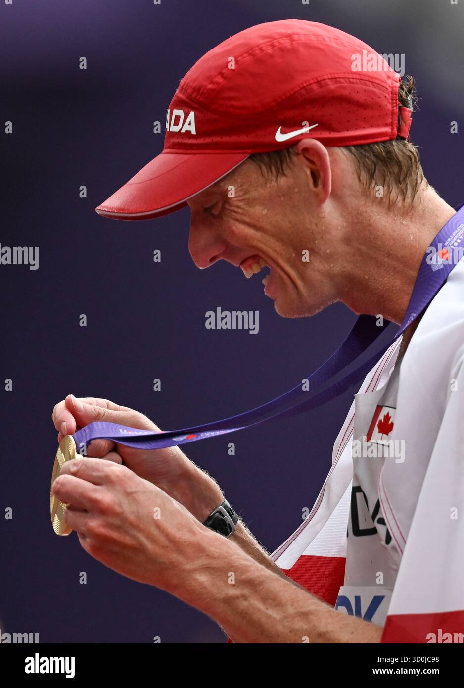 Evan Dunfee of Canada wins the 35k Mens walk and shows off his gold ...